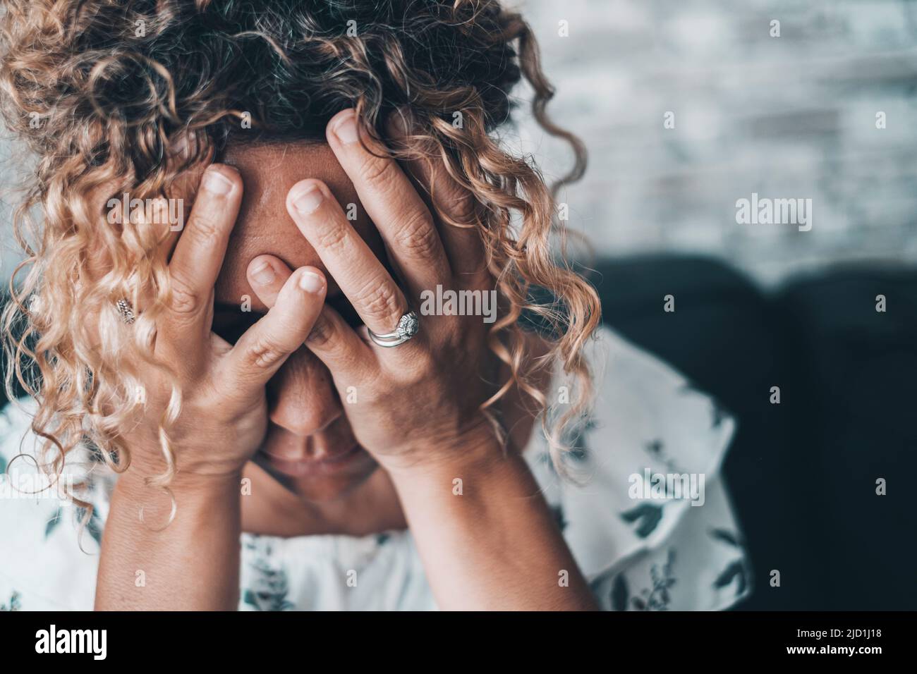 Bad emotions and problems for a worried and desperate woman holding ...