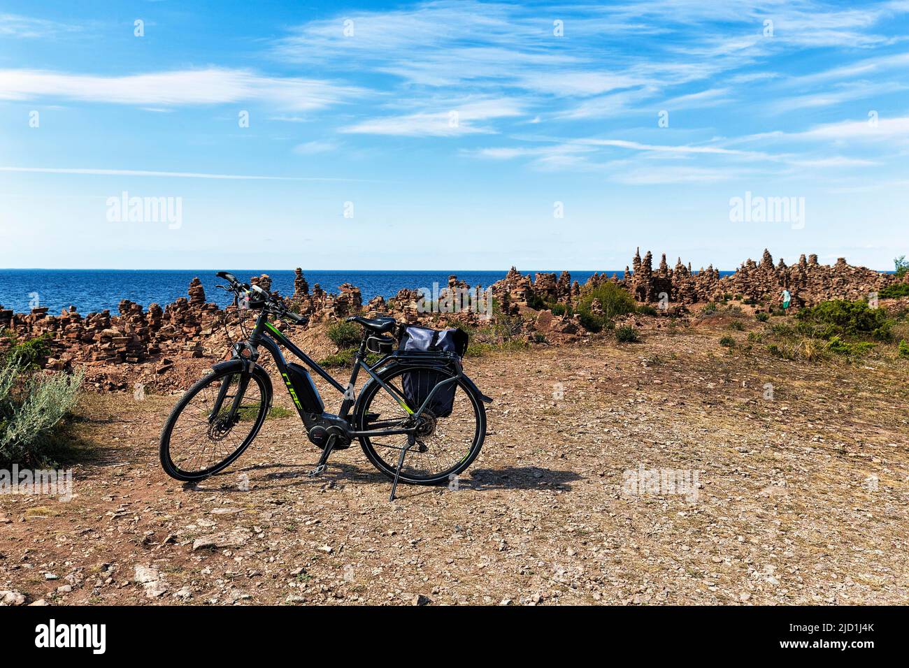 E-bike on rocky coast, piled up up quarry stones, Oelandsleden cycle ...