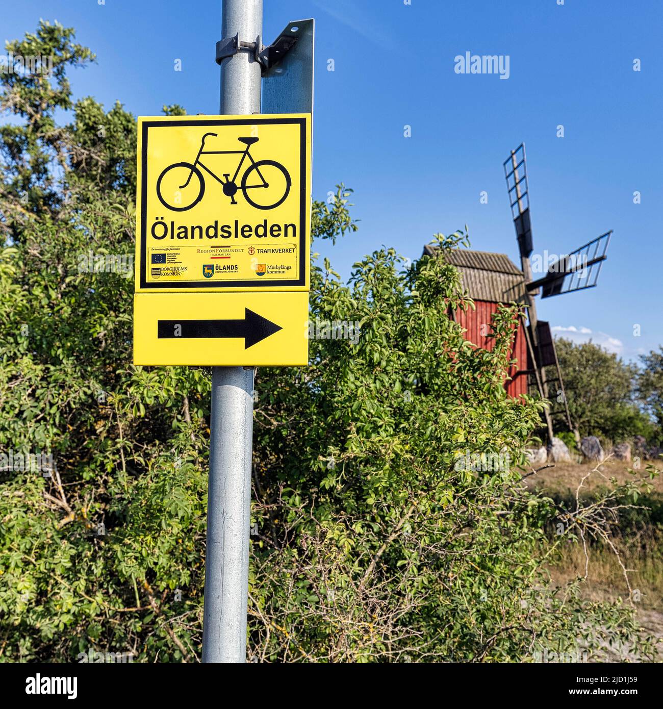 Yellow traffic sign, signpost with pictogram bicycle for Swedish cycle ...