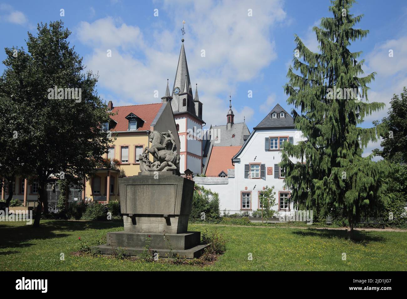 Park with war memorial and tower of the Gothic St. Martin Church in ...