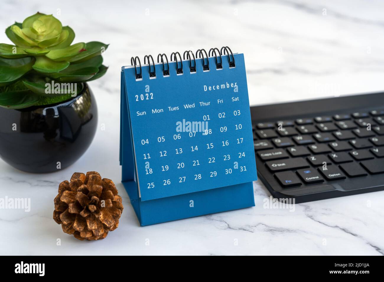 December 2022 desk calendar on top of office desk Stock Photo - Alamy