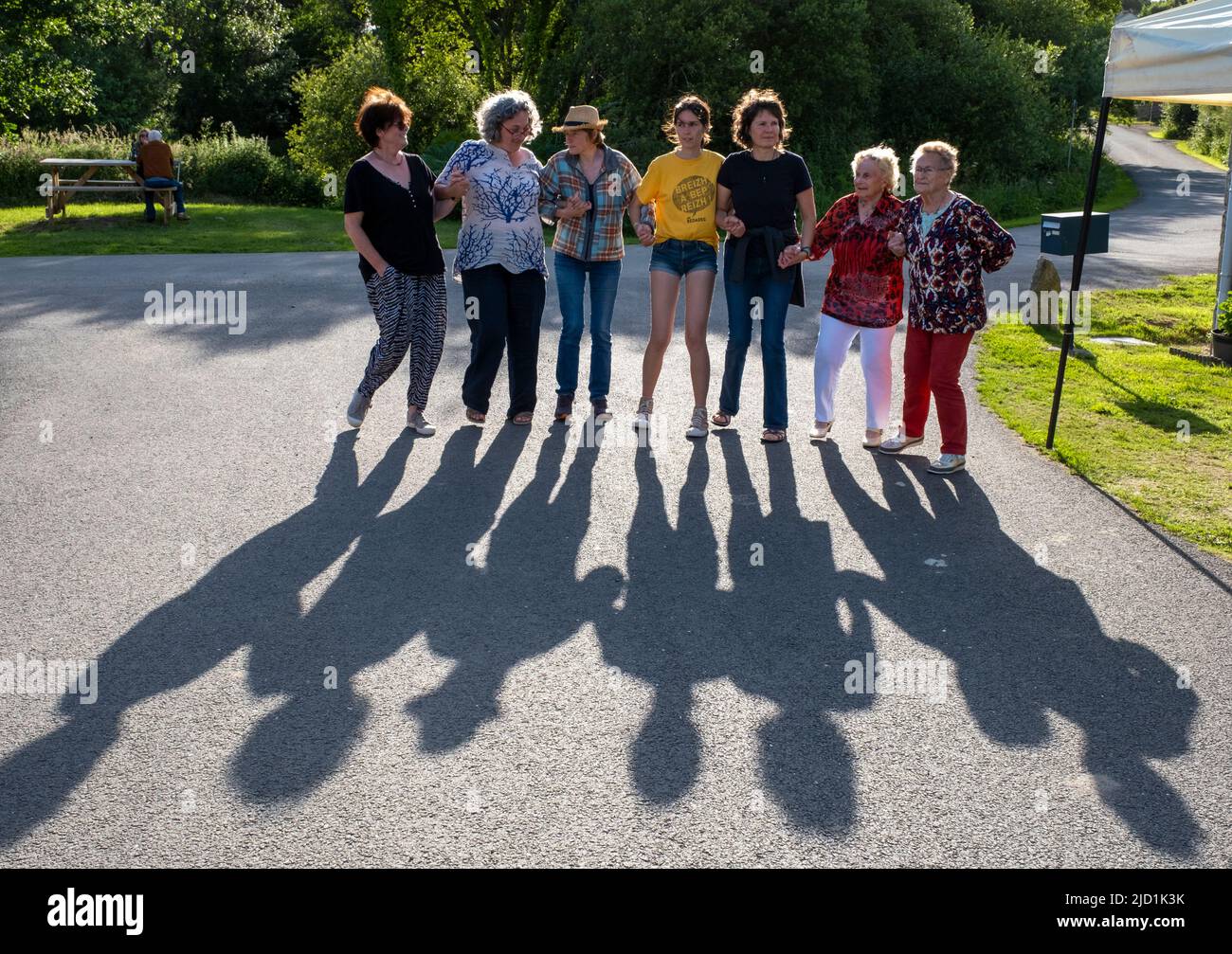 A group of women doing a local Breton dance in the sunshine, Quinoualch ...