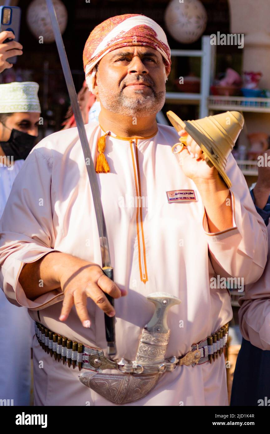 Man performing traditional songs during the Friday Goat Market in Nizwa ...