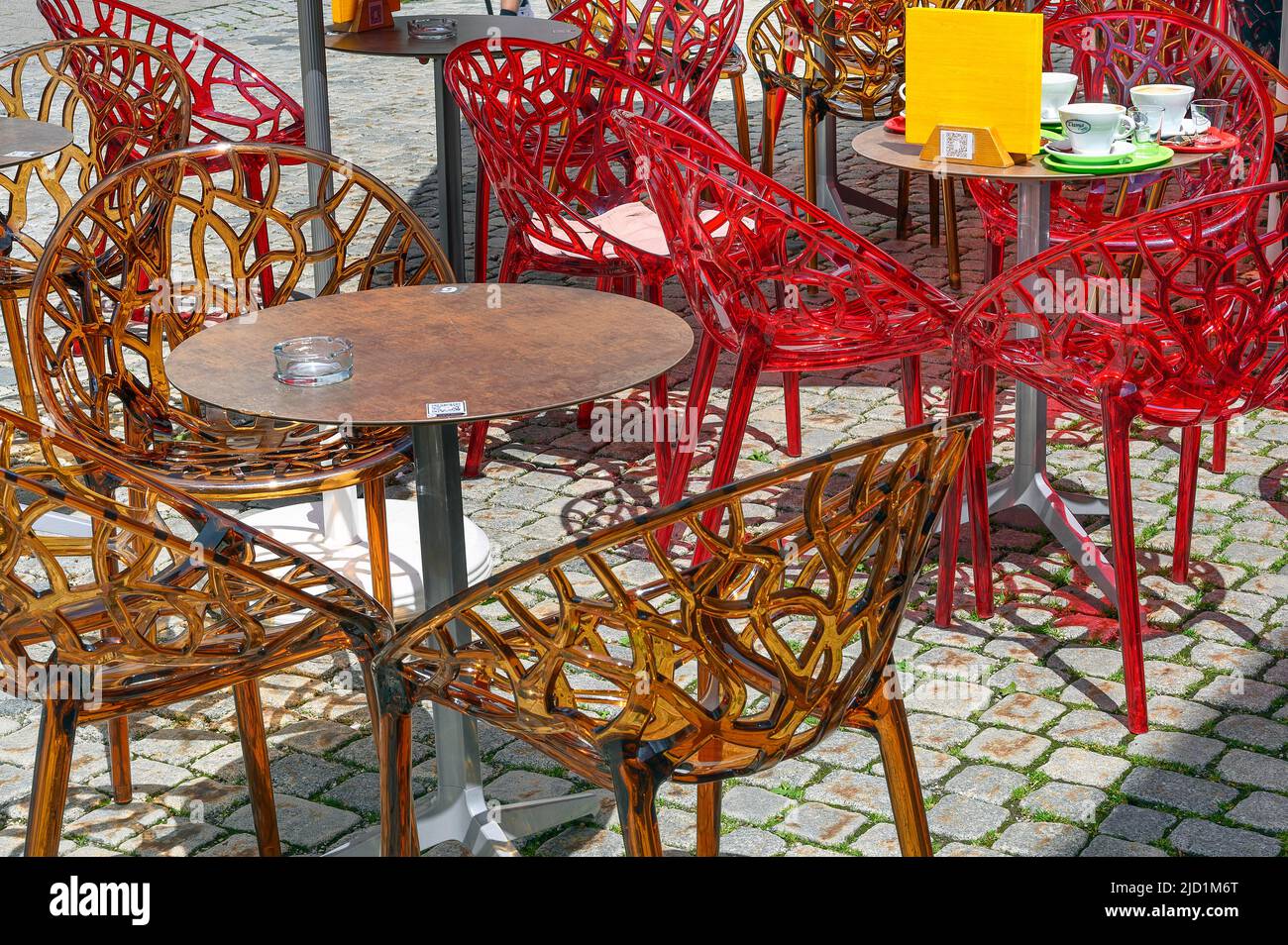 Colourful plastic chairs, cafe in pedestrian zone, Isny, Allgaeu ...