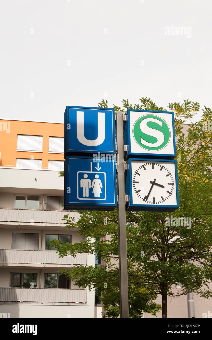 Signage for underground, suburban railway, lift, station clock, Munich ...
