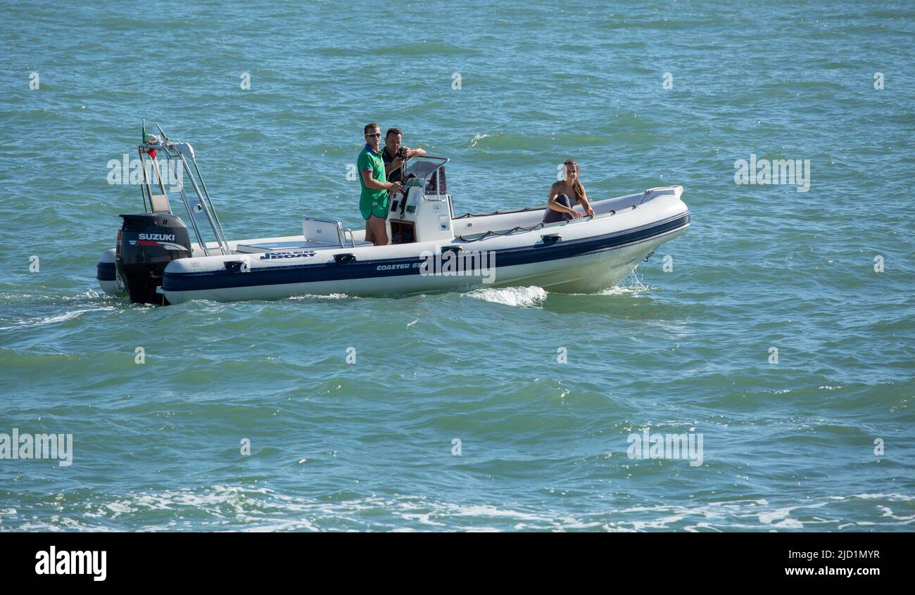 passengers standing on a speed boat, during a trip out Stock Photo - Alamy