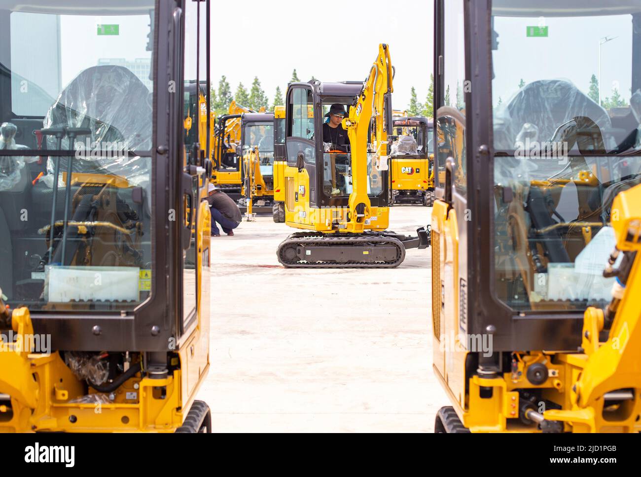 SUZHOU, CHINA - JUNE 16, 2022 - Workers rush to make mini excavators ...