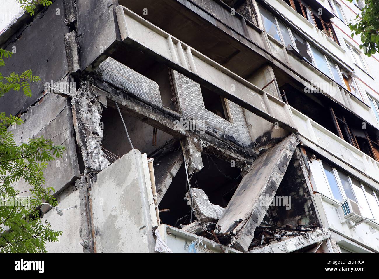 KHARKIV, UKRAINE - JUNE 16, 2022 - A destroyed prefab apartment block ...