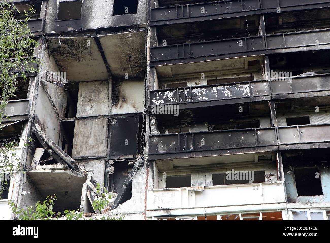 KHARKIV, UKRAINE - JUNE 16, 2022 - A soot-covered prefab apartment ...