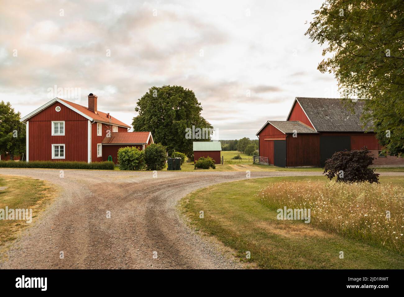 Falun red farm in rural landscape Stock Photo - Alamy