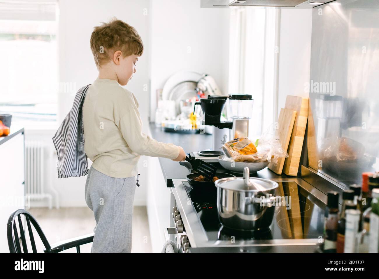 Boy preparing food in kitchen Stock Photo - Alamy