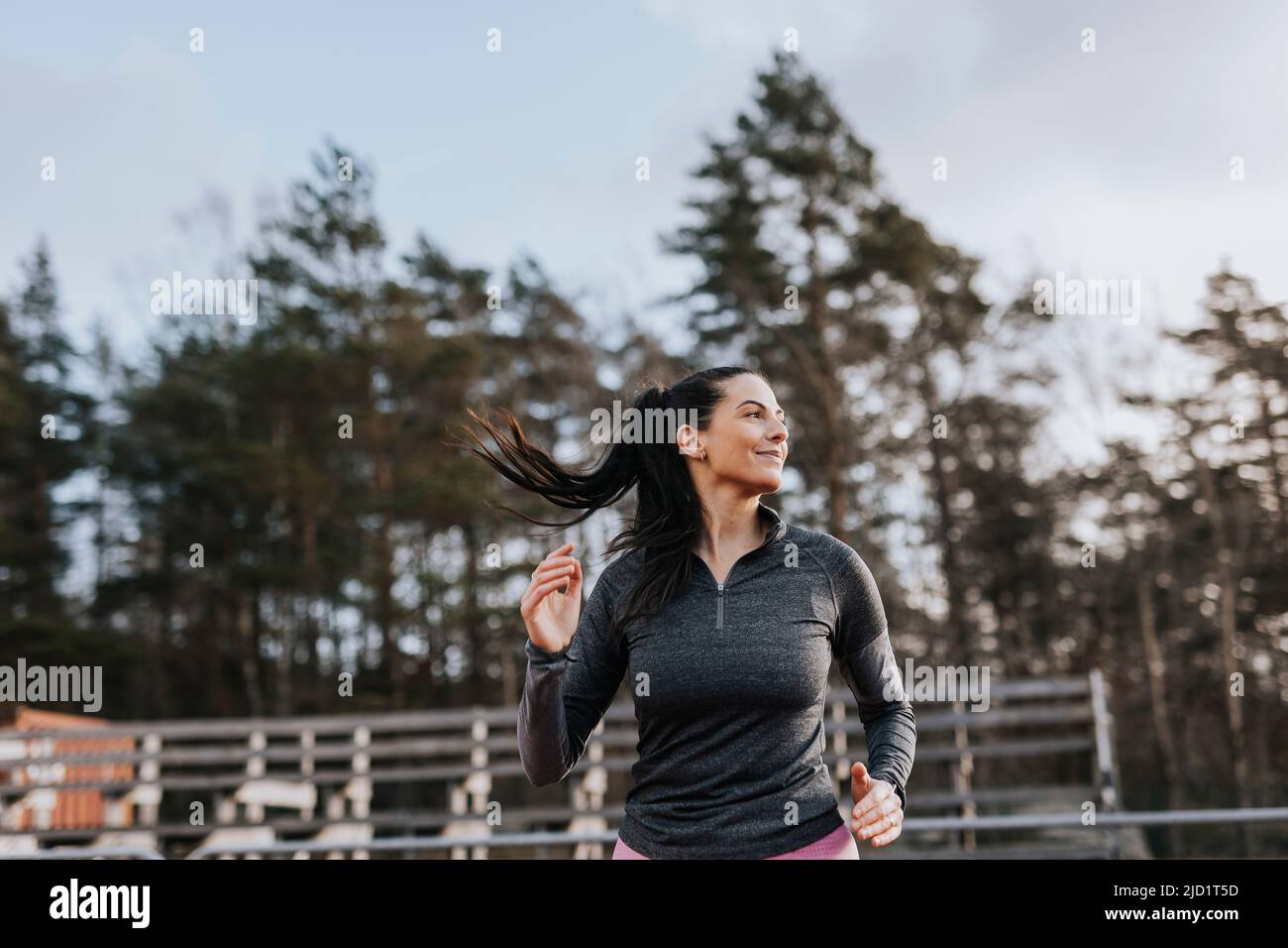Smiling woman exercising Stock Photo - Alamy