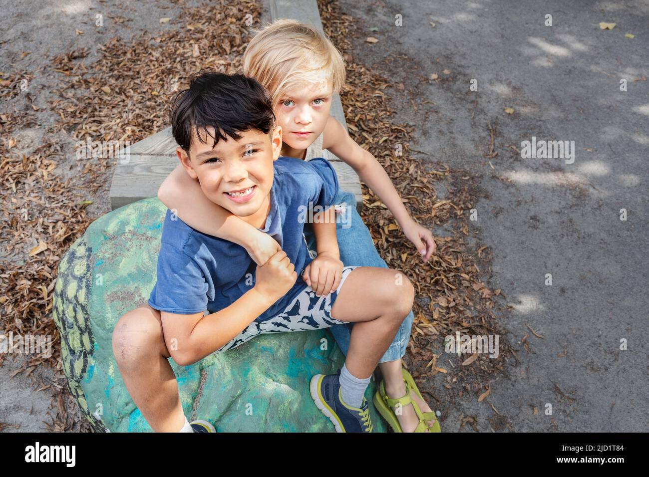 Portrait of child friends embracing Stock Photo - Alamy
