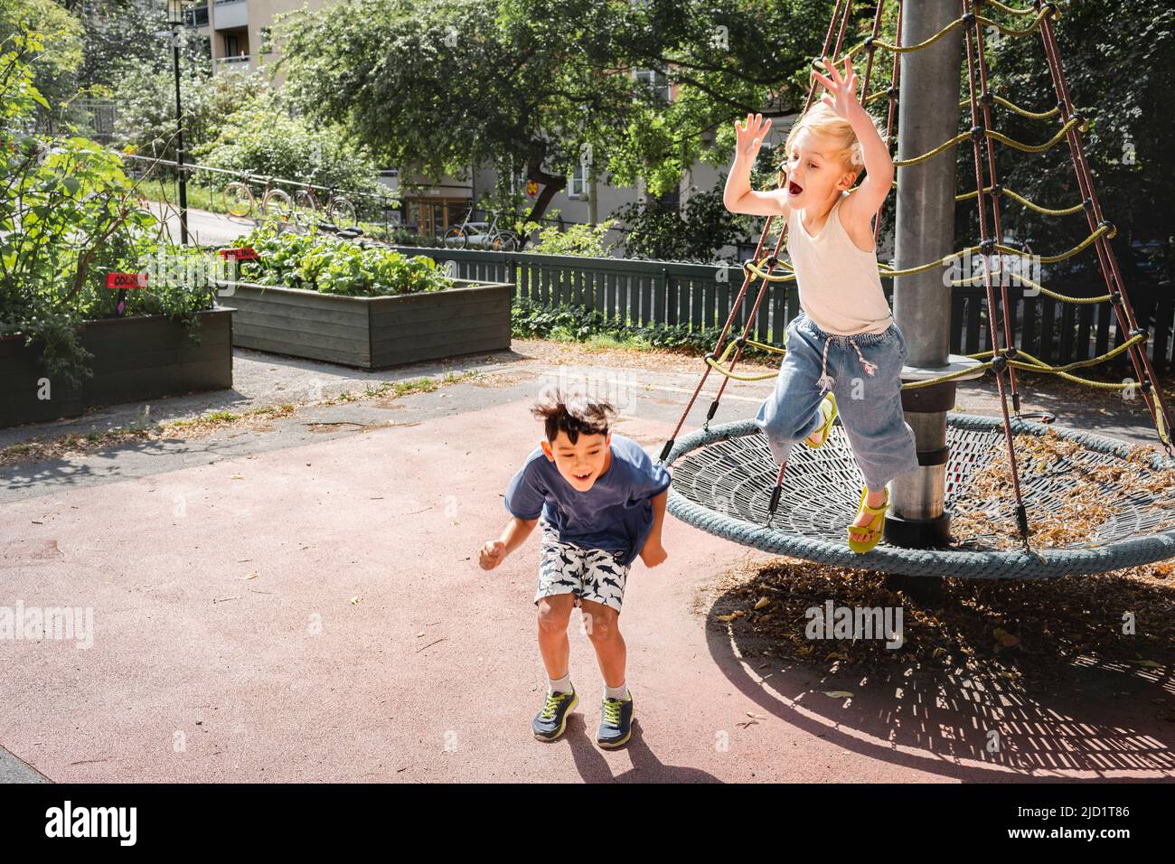 Child friends playing in playground Stock Photo - Alamy