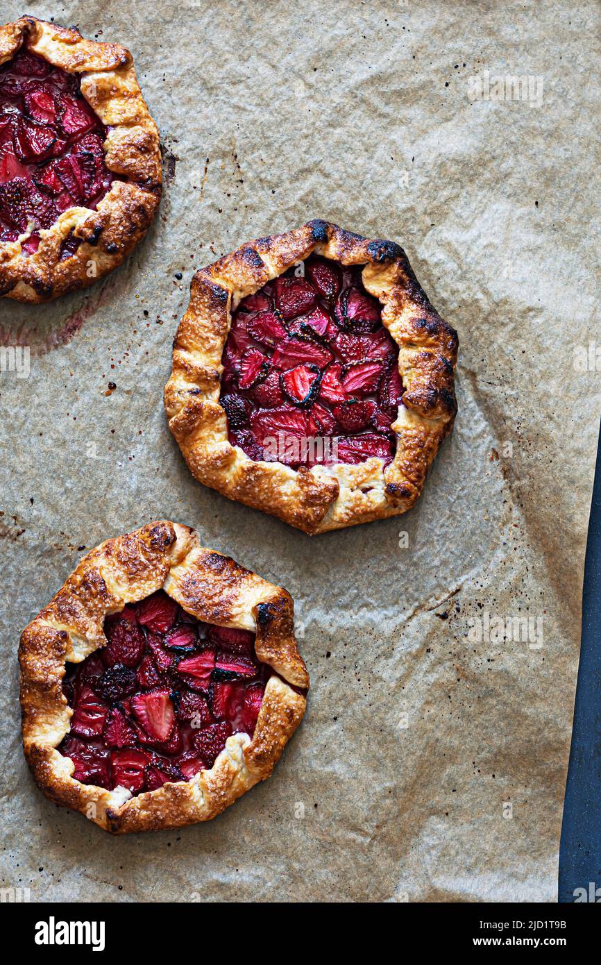 French dessert Galette with shortbread and strawberries. Open pie with ...