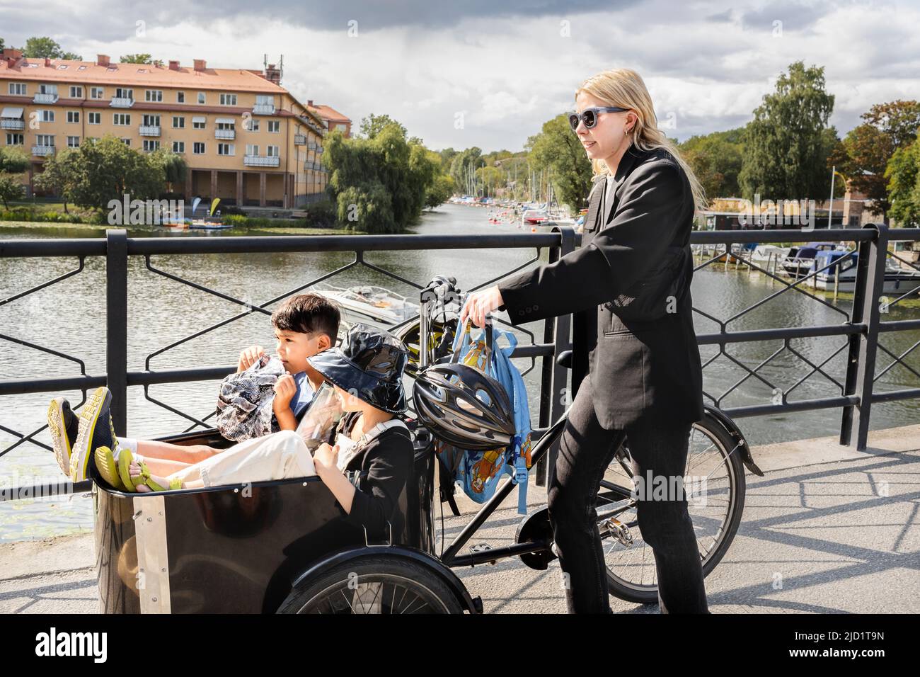 Boy pushing bicycle hi-res stock photography and images - Alamy
