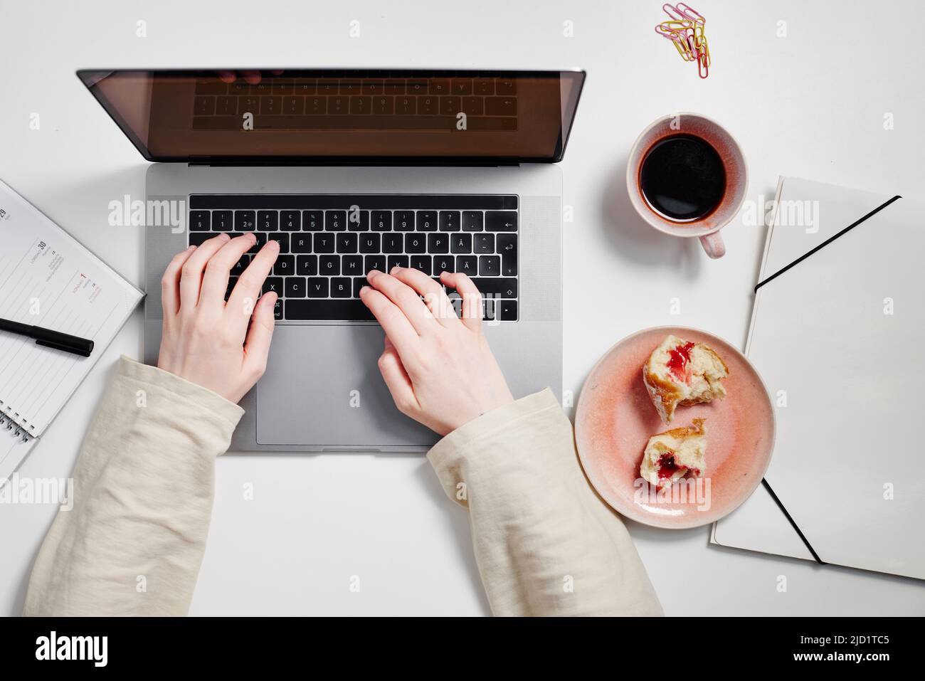 Woman's hands using laptop Stock Photo - Alamy