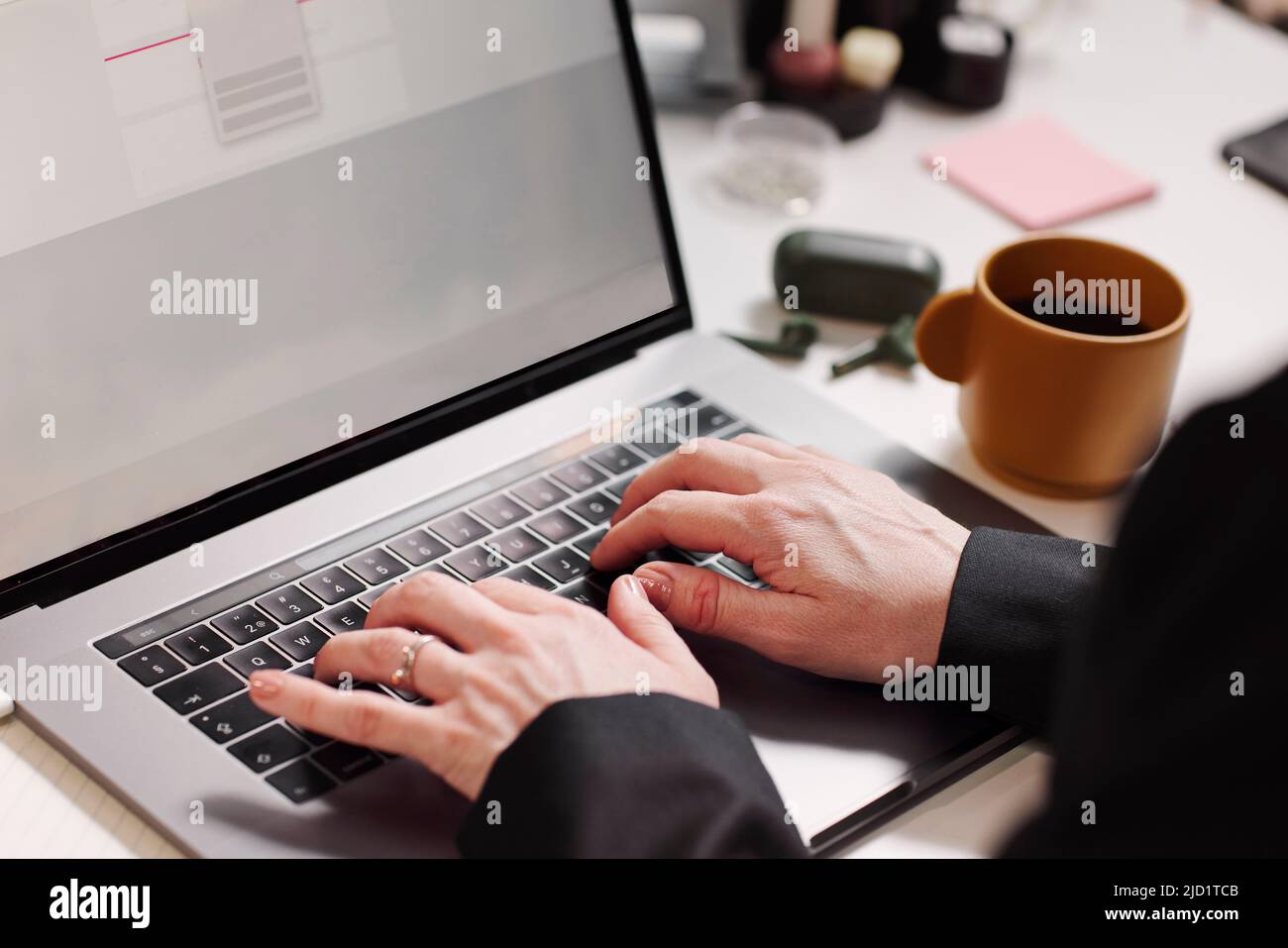 Woman's hands using laptop Stock Photo - Alamy
