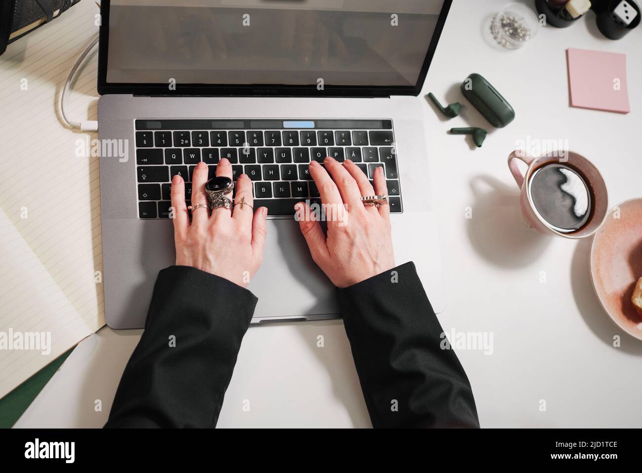Woman's hands using laptop Stock Photo - Alamy