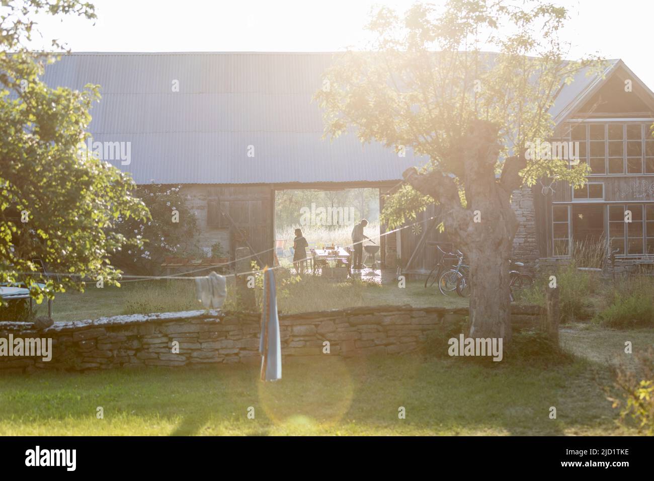 Silhouettes of people near house Stock Photo - Alamy