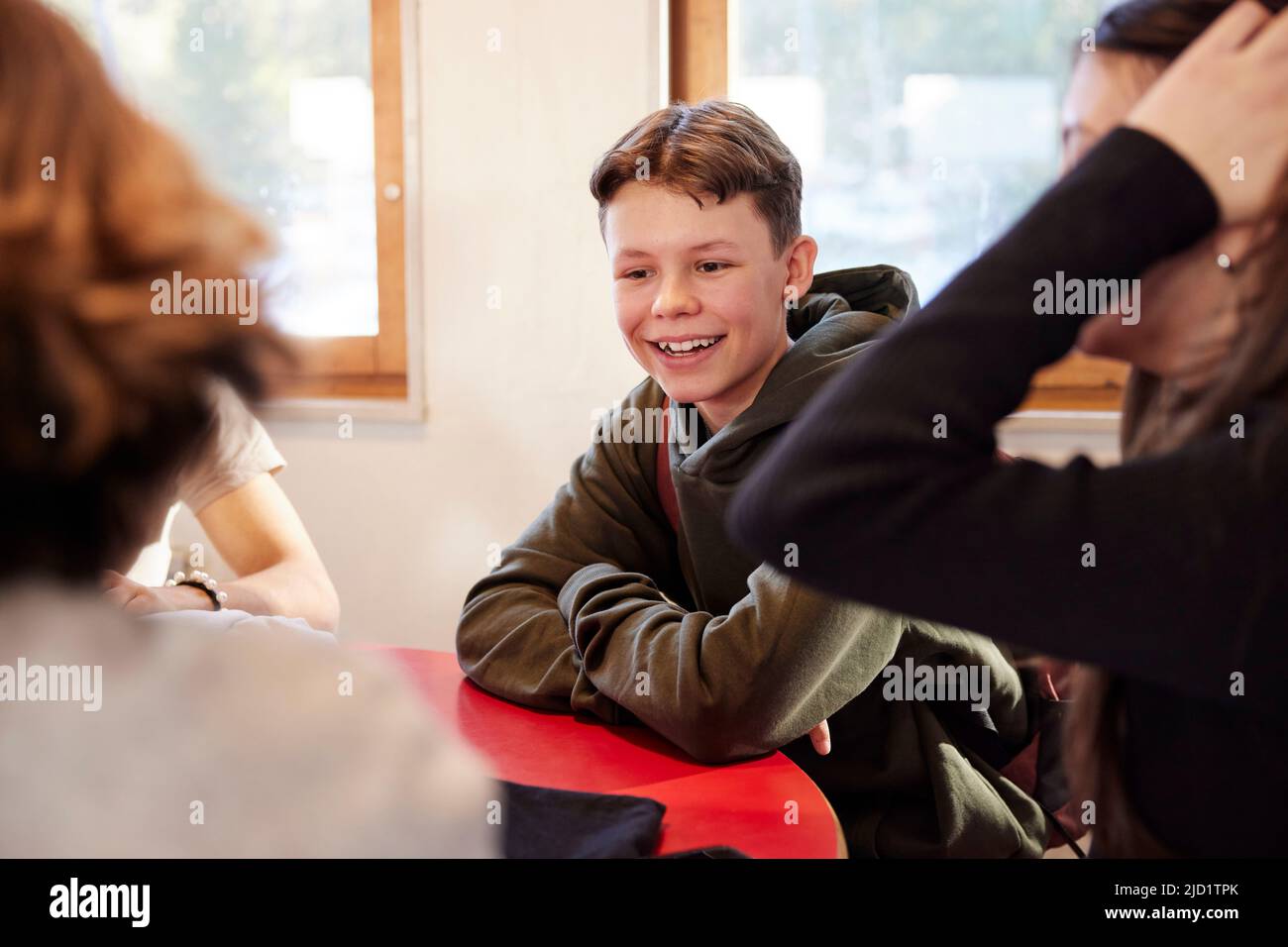 Teenagers talking together Stock Photo - Alamy