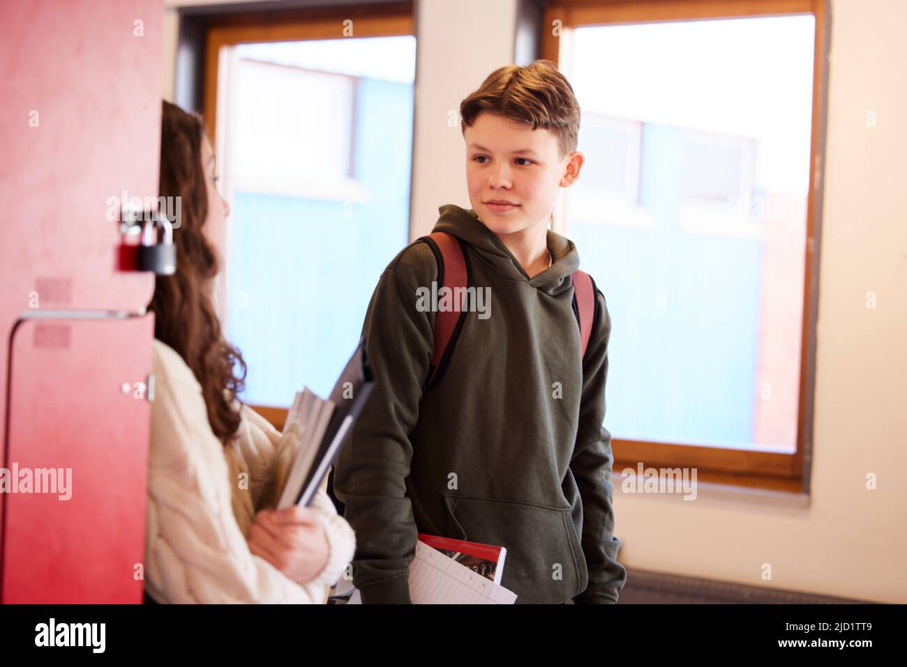 Teenagers talking at corridor Stock Photo - Alamy