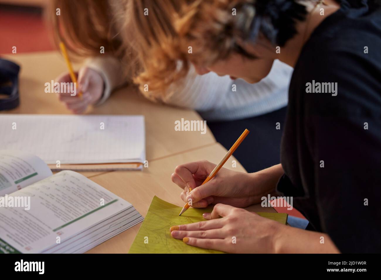 Student making sketch in class Stock Photo - Alamy