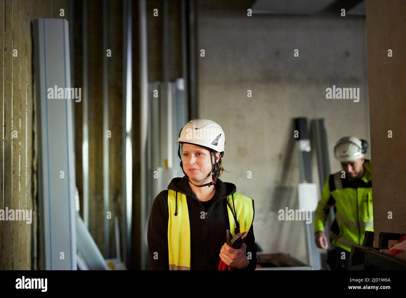 Female worker at building site Stock Photo - Alamy
