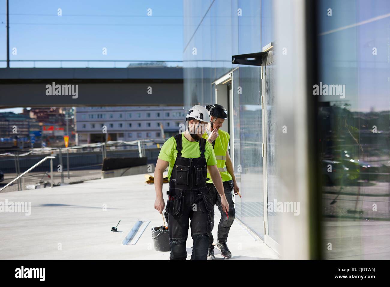 Three construction workers walking hi-res stock photography and images ...