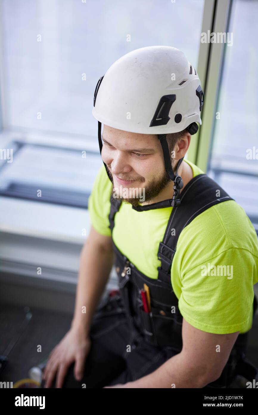 Positive smiling construction worker hi-res stock photography and ...
