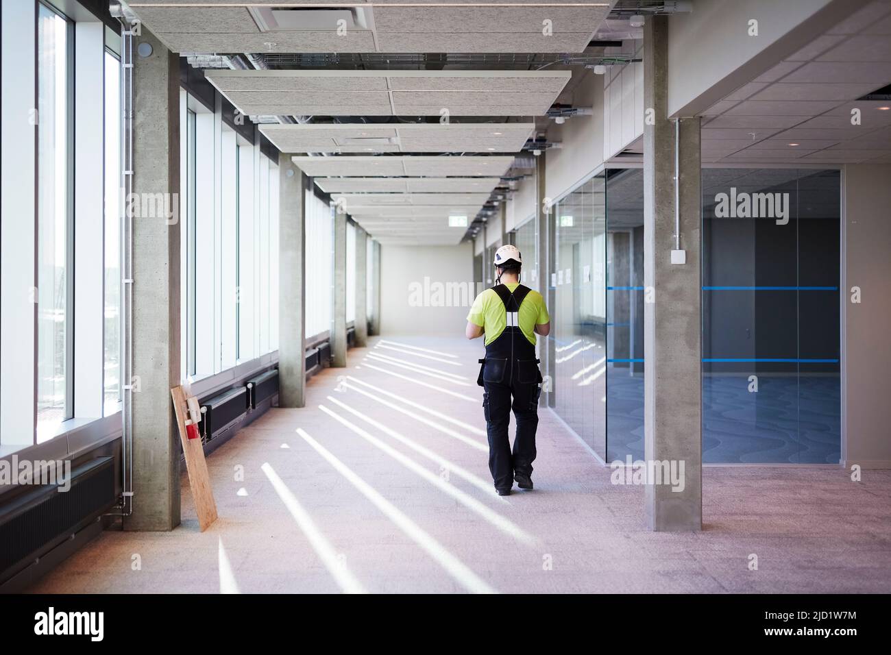 Worker at building site Stock Photo - Alamy
