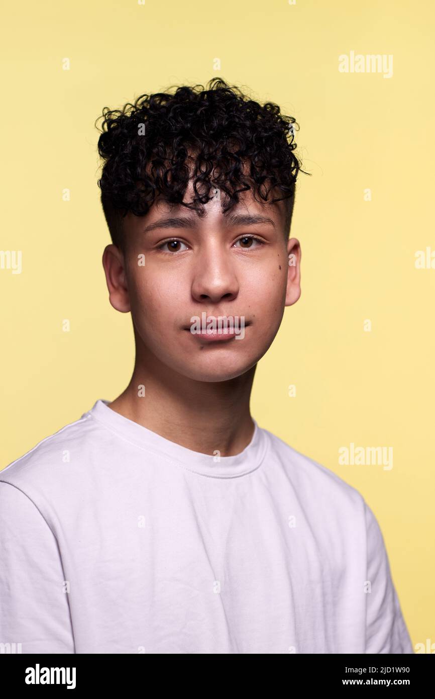 Portrait of boy against yellow background Stock Photo - Alamy