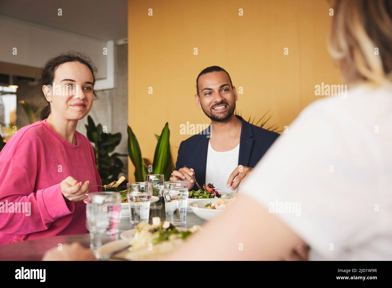 Three men eating together restaurant hi-res stock photography and ...