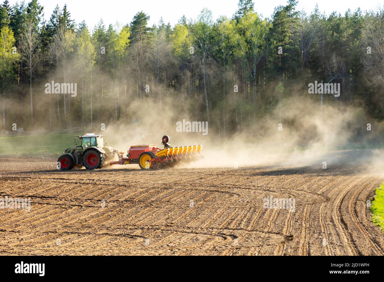Tractor working on farm Stock Photo - Alamy