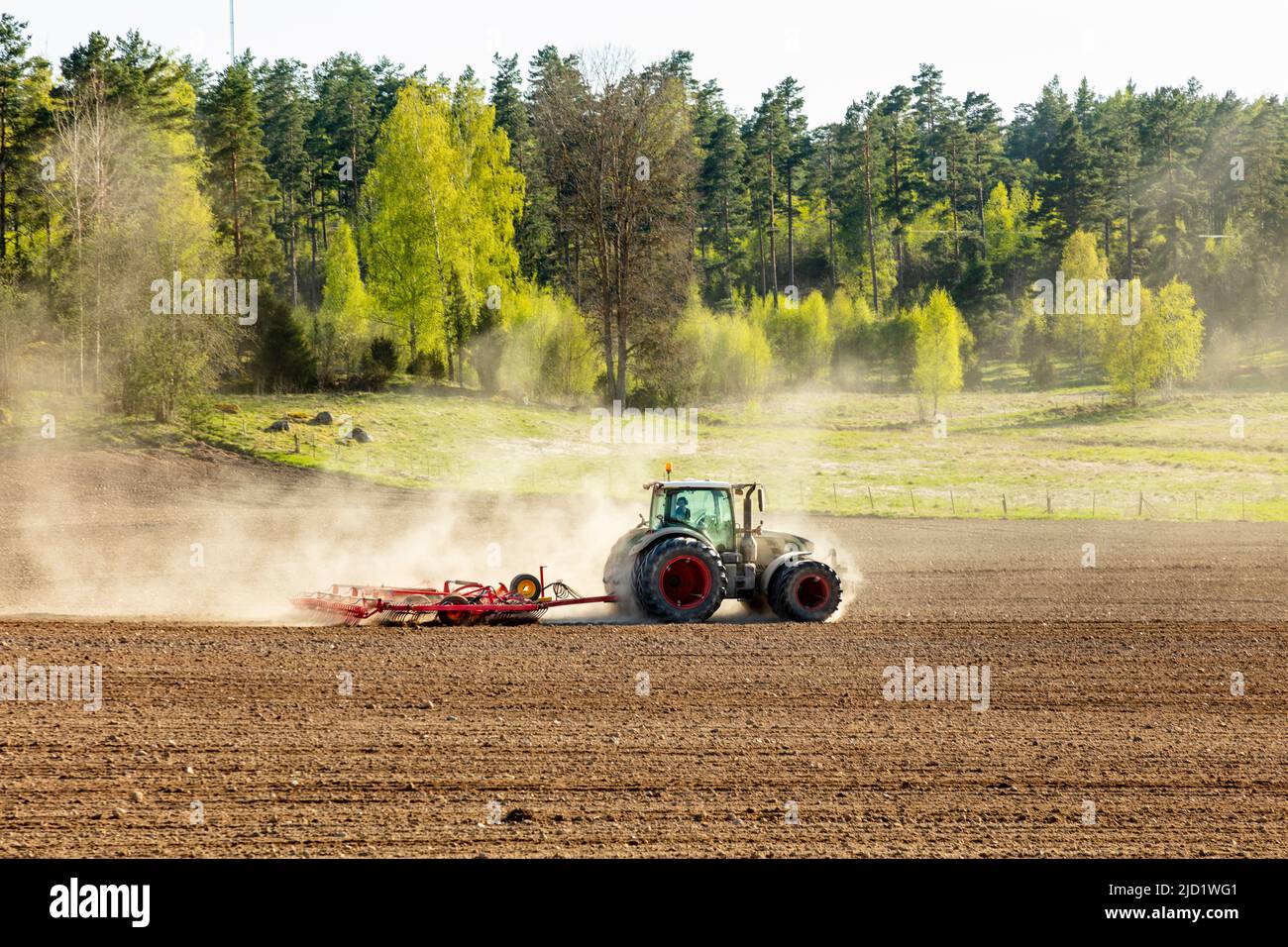 Tractor working on farm Stock Photo - Alamy