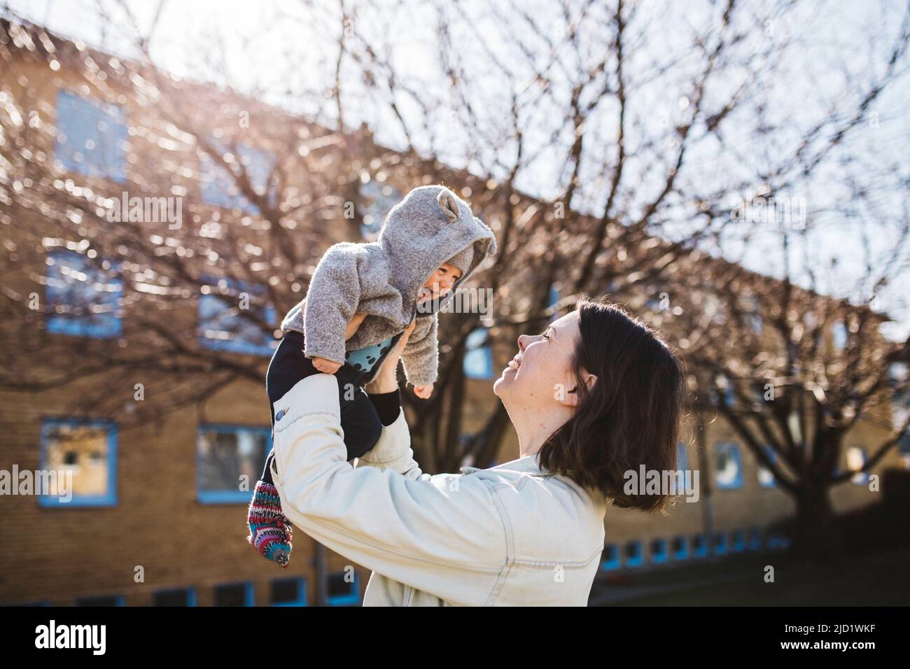 Happy family mother carrying baby hi-res stock photography and images ...