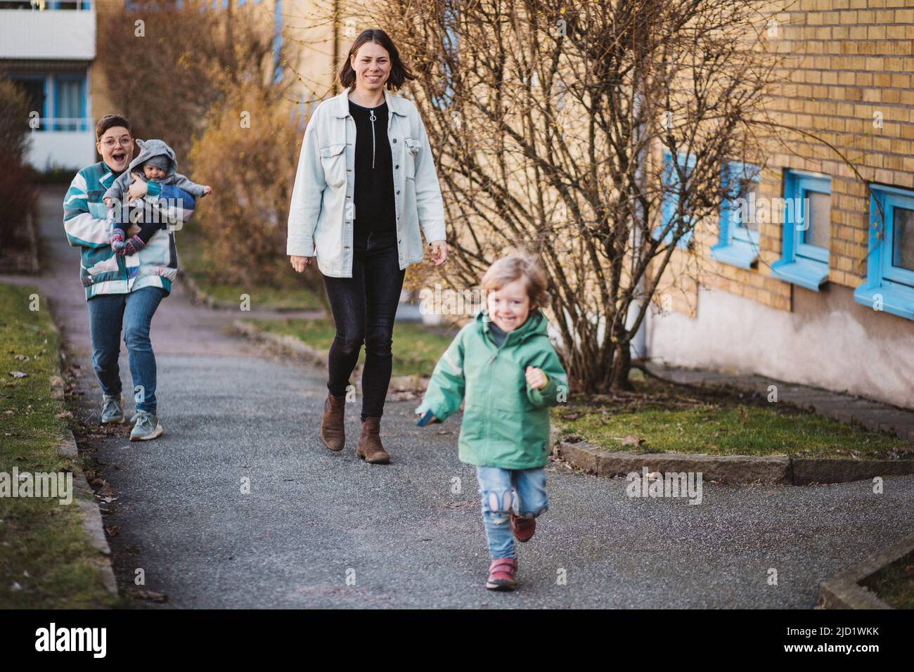 Women having walk with children Stock Photo - Alamy