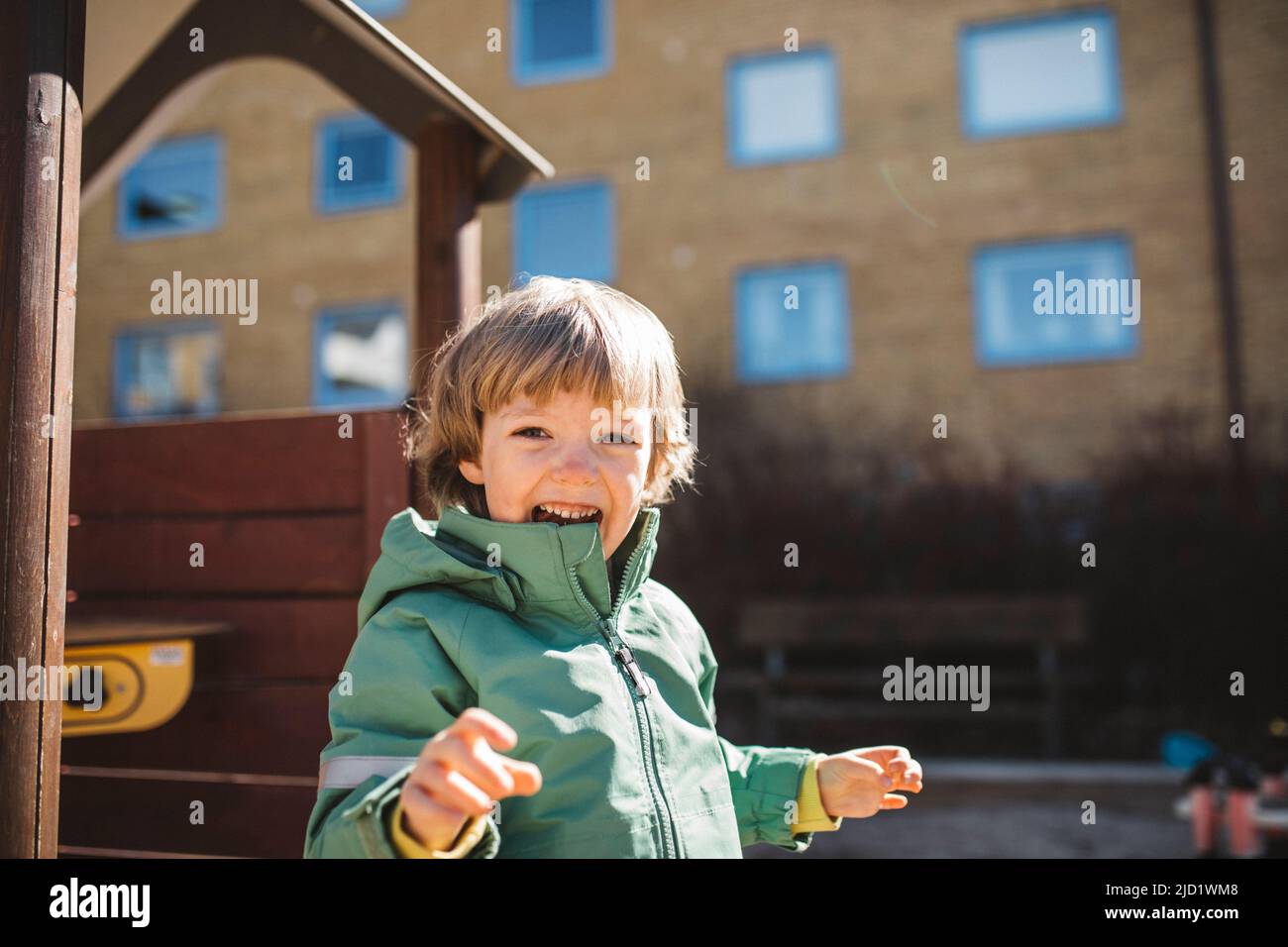 Boy having fun on playground Stock Photo - Alamy