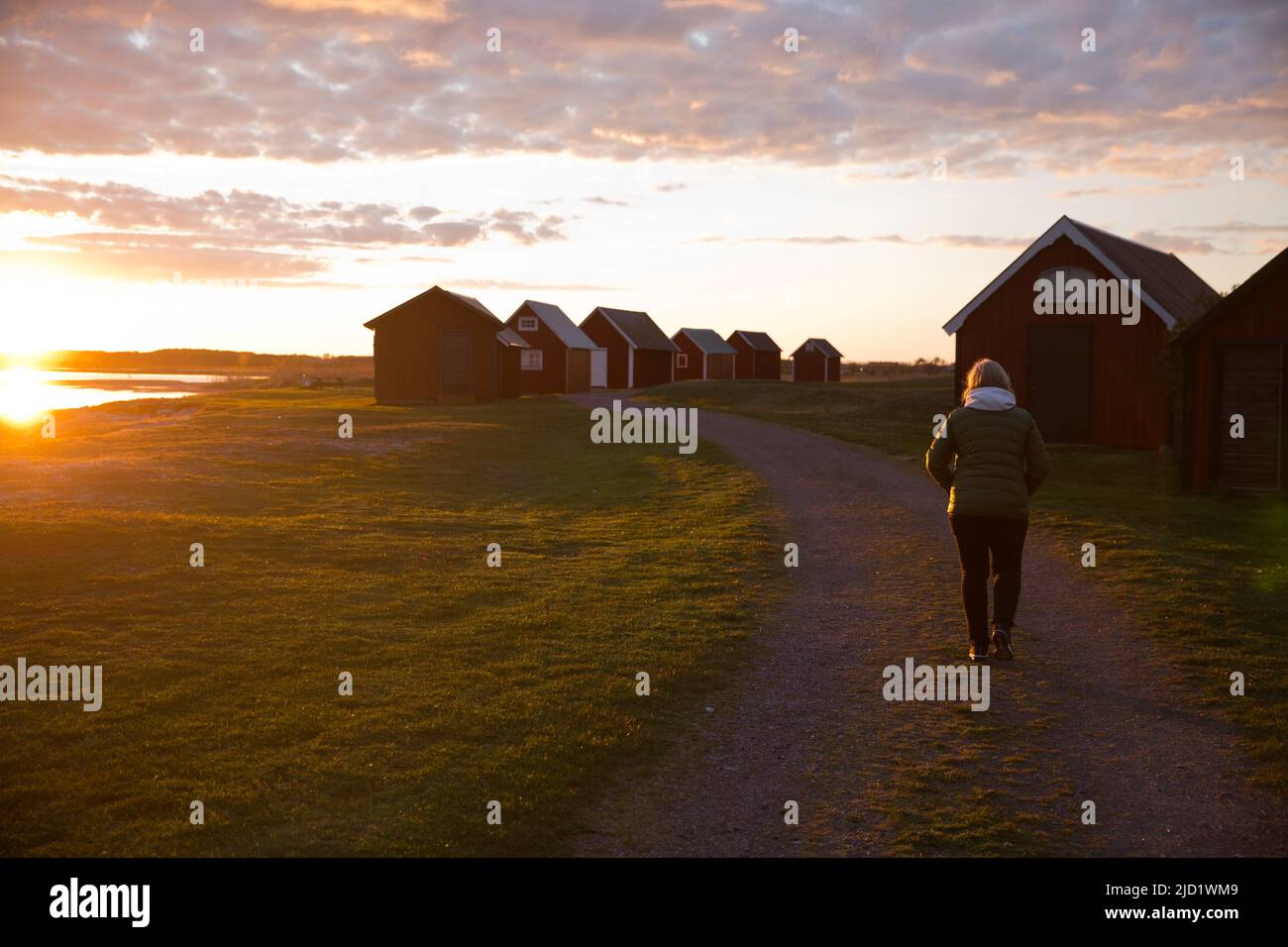 Coastal houses at sunset Stock Photo - Alamy