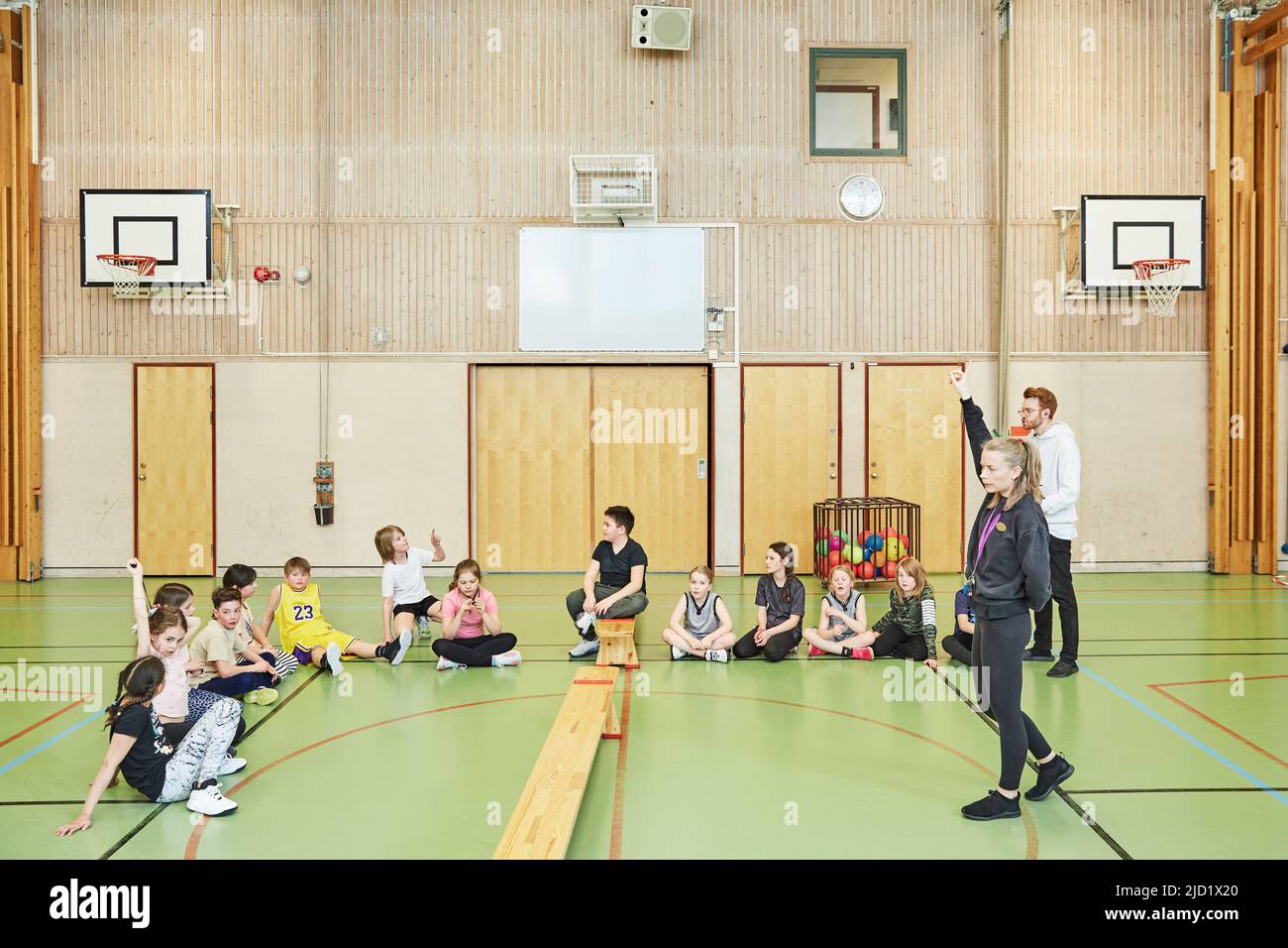 Children having class in school gym Stock Photo - Alamy