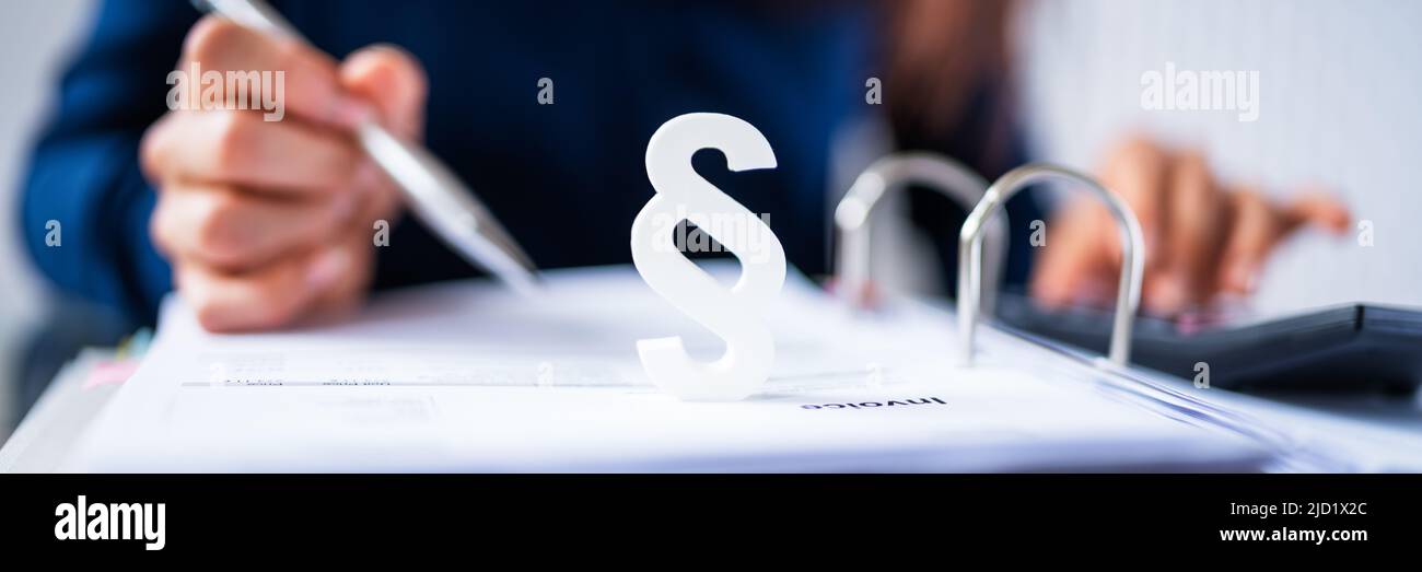 Close-up Of A Red Paragraph Symbol In Front Of Person Working At ...