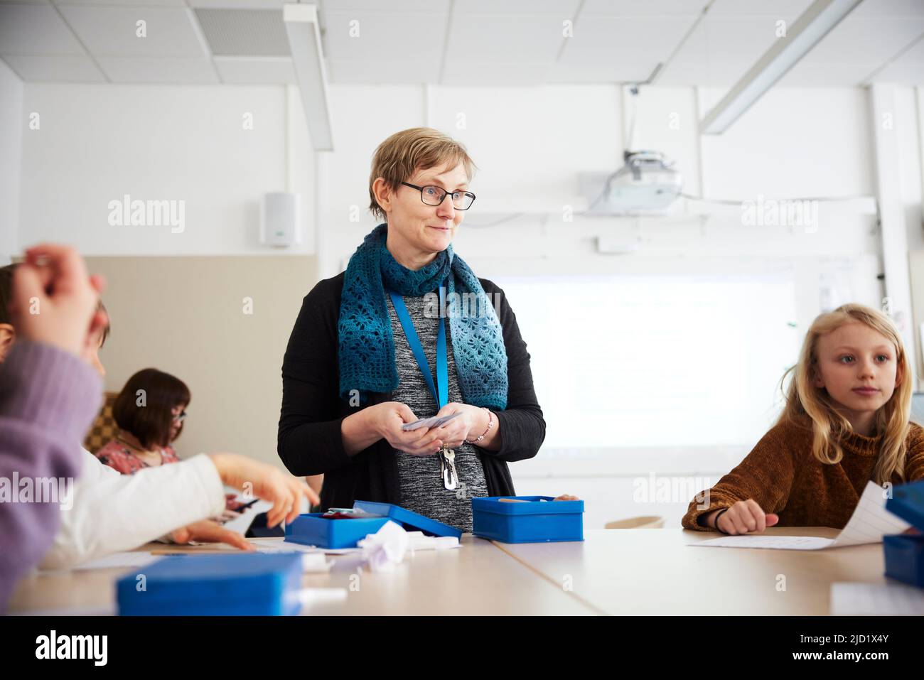 Teacher and students in classroom Stock Photo - Alamy