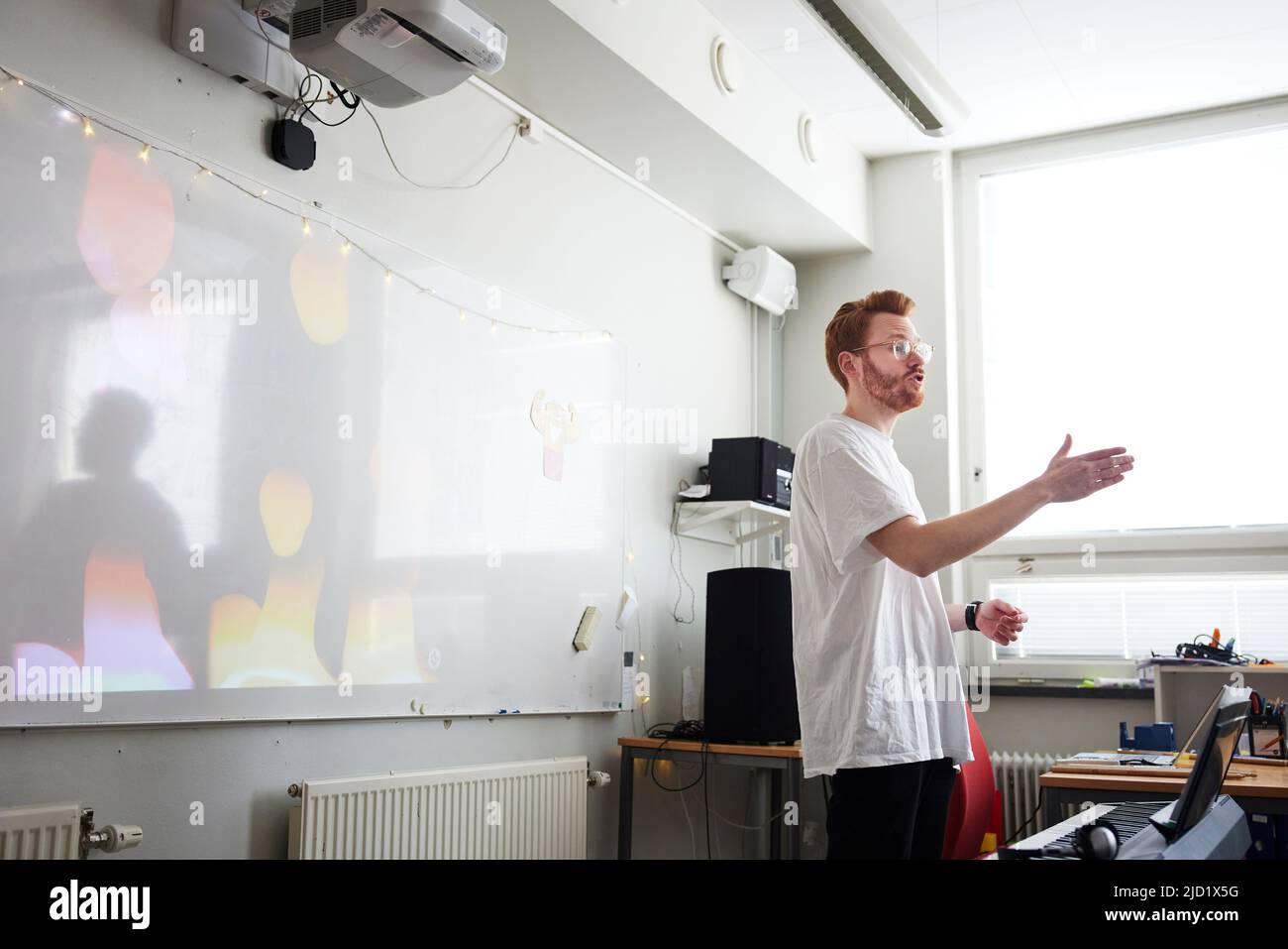 Male teacher having class Stock Photo - Alamy