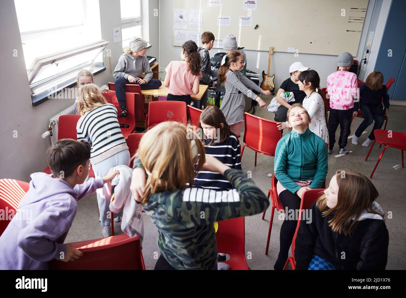 Children interacting at school Stock Photo - Alamy