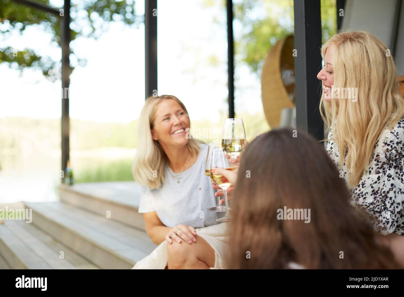Female friends relaxing outdoor Stock Photo - Alamy