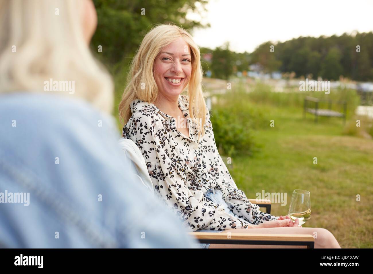 Woman relaxing evening glass hi-res stock photography and images - Alamy
