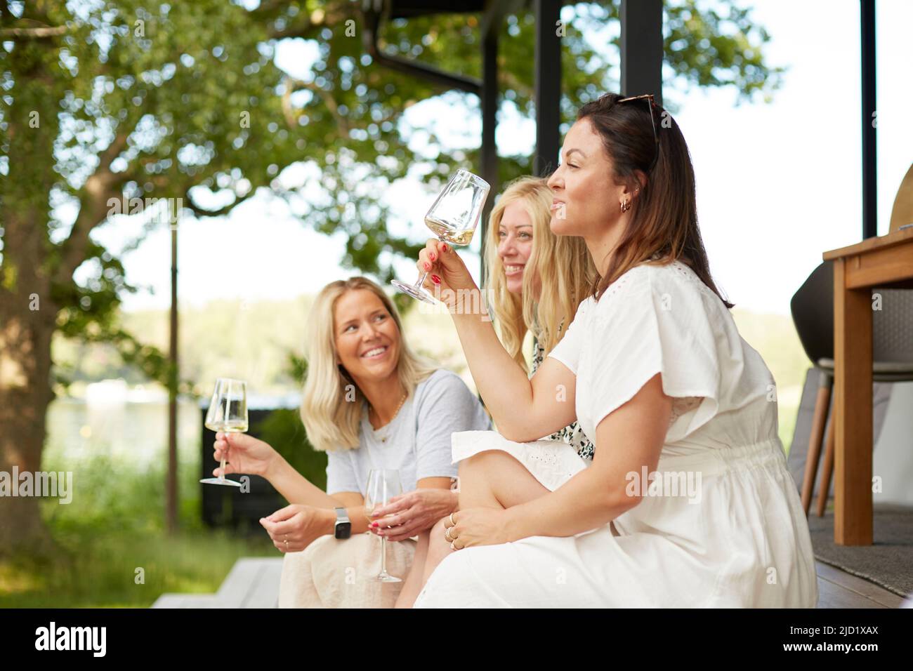 Female friends relaxing outdoor Stock Photo - Alamy