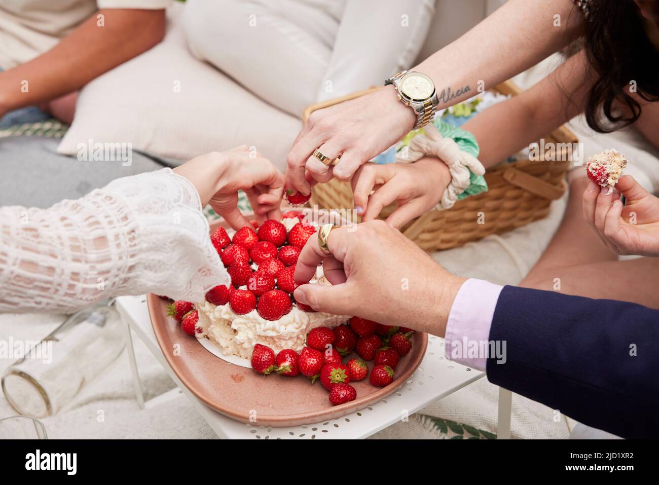 Family eating strawberry cake Stock Photo - Alamy