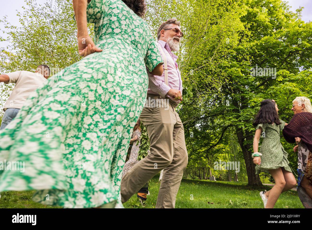 People dancing in garden Stock Photo - Alamy