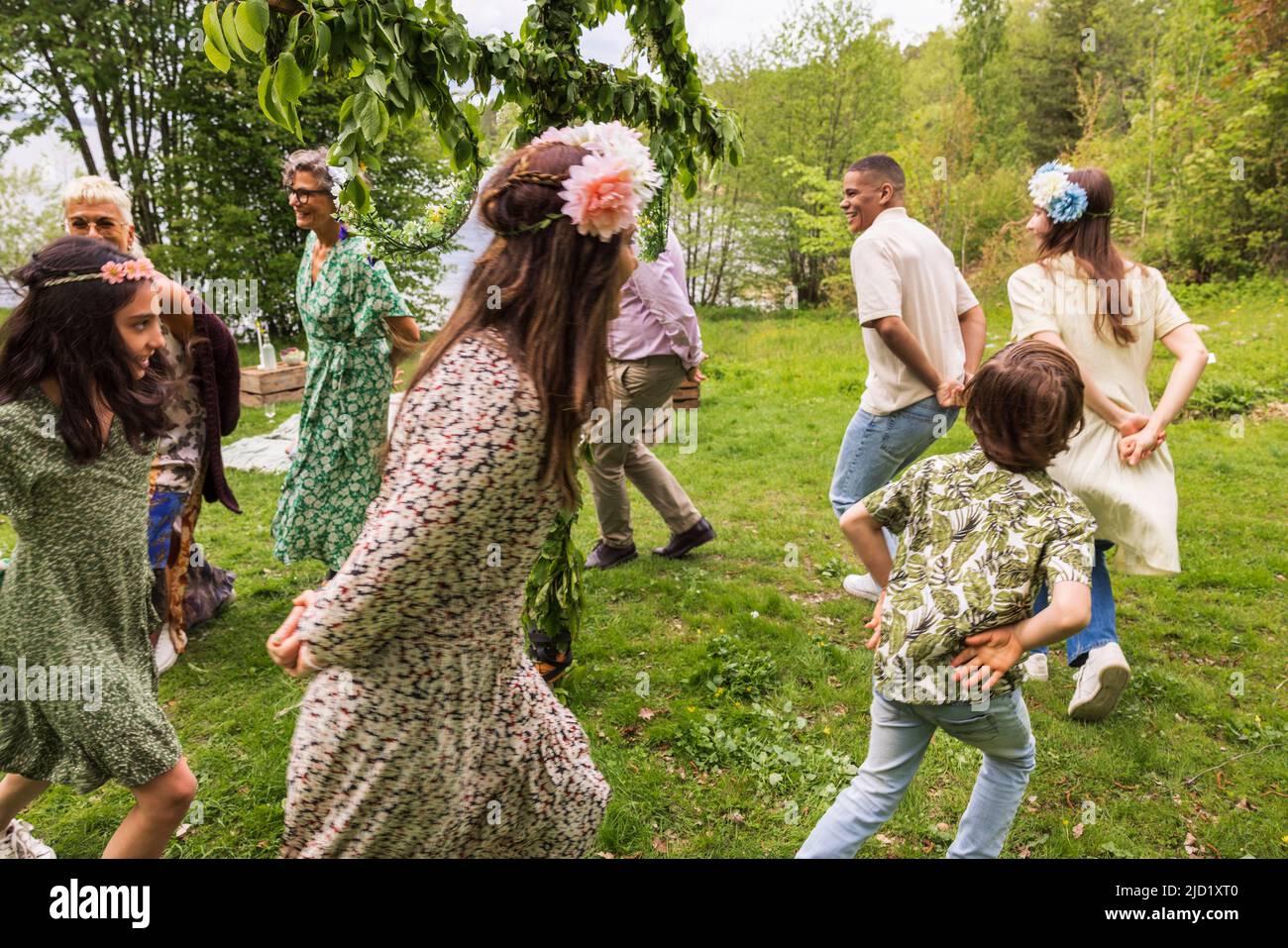 People dancing around midsummer maypole Stock Photo - Alamy